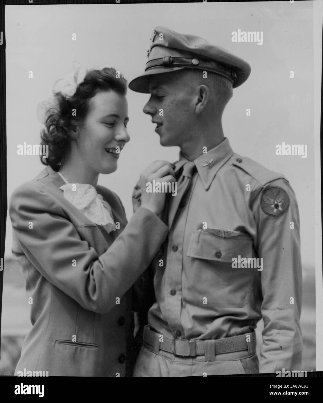 Lieutenant and Mrs. Robert L. Maddox are photographed, highlighting ...