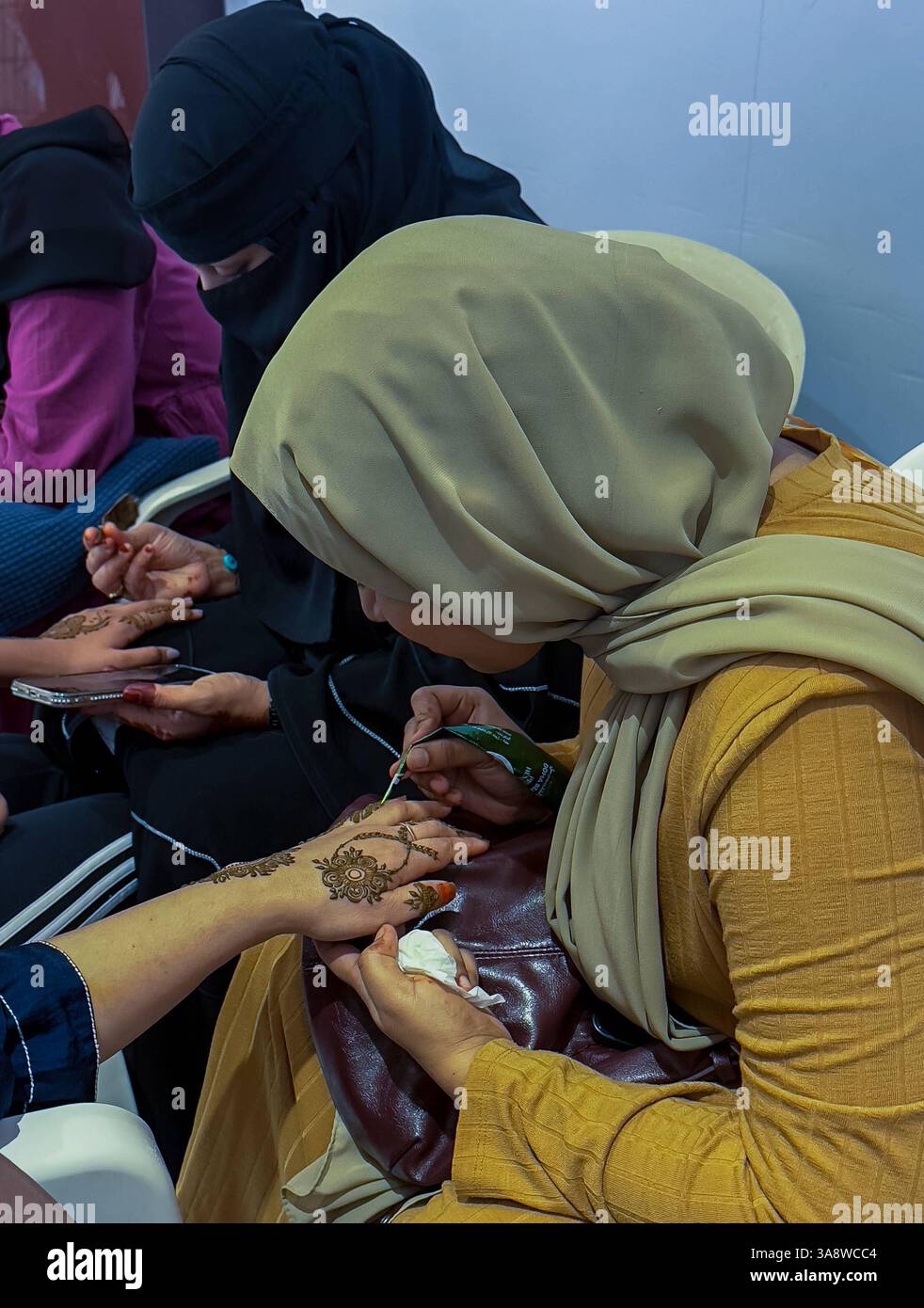 Eid-al-fitr Preparations 2025 Doha Women gets her hand decorated with henna at a mall ahead of ...