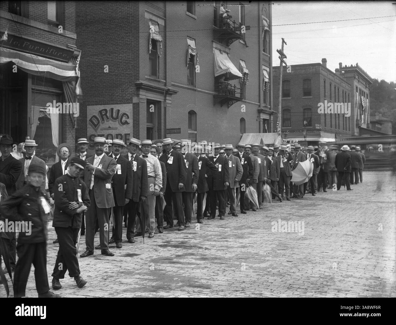 A photo captures around 100 men in straw hats at the 44th Elks ...