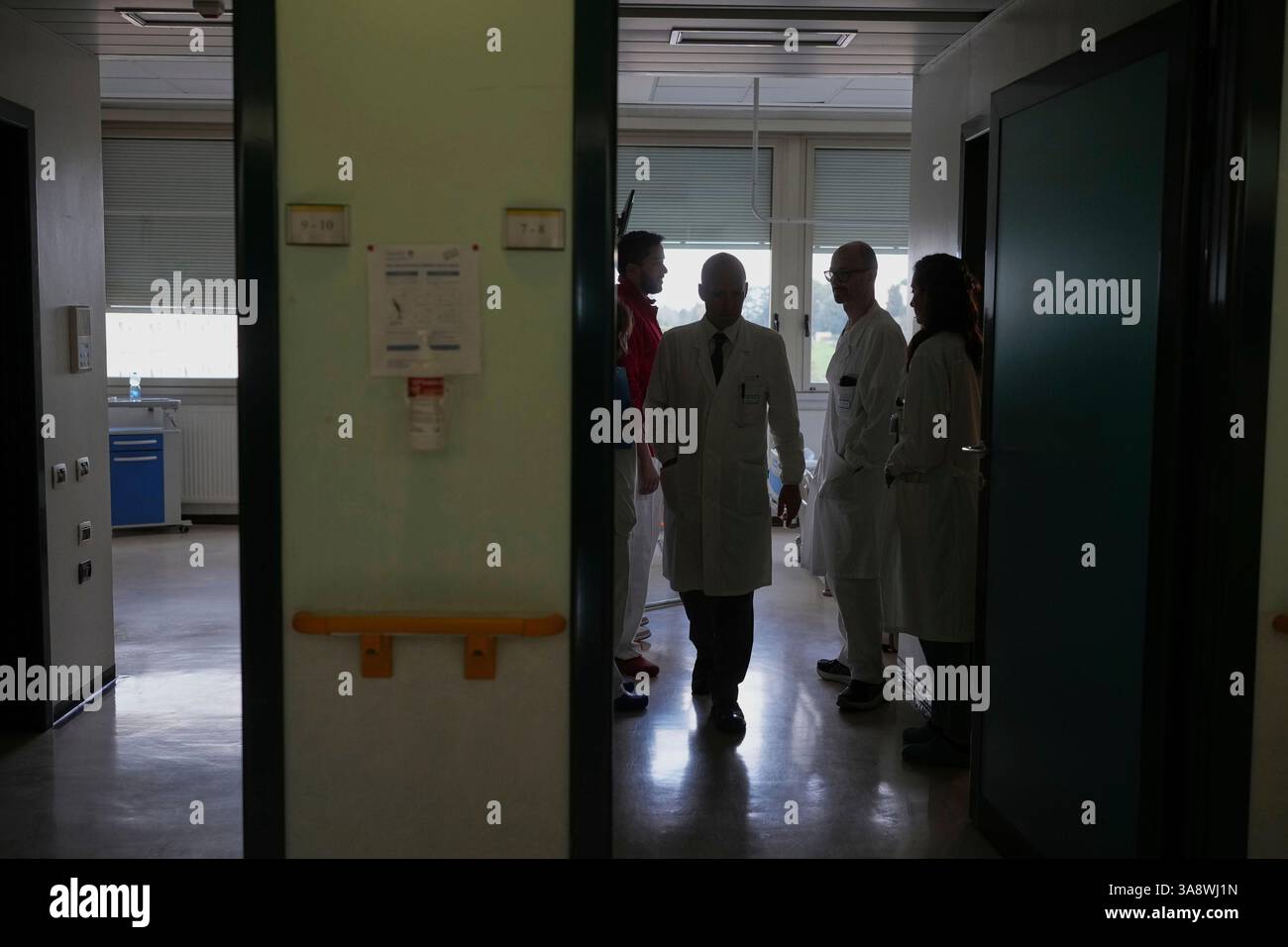 Professor and surgeon Sergio Alfieri, second from left, who headed the ...