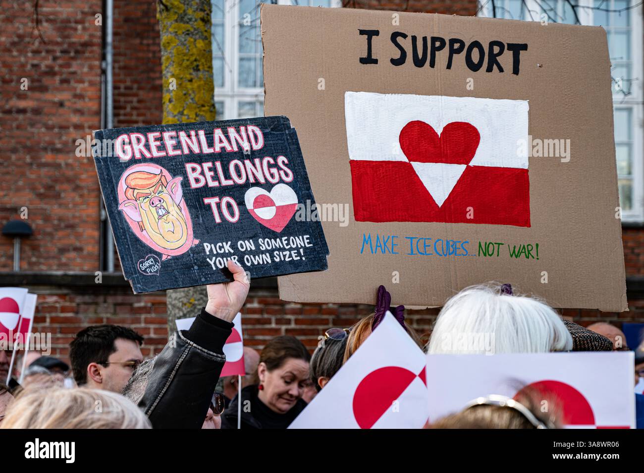 Protesters hold placards as they participate in a demonstration in ...