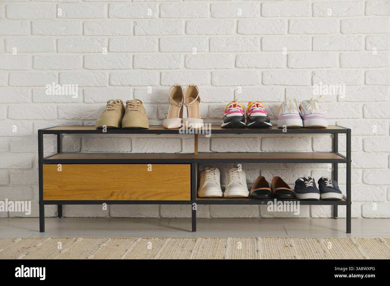 Shoe storage. Shelving unit with different footwear indoors Stock Photo ...