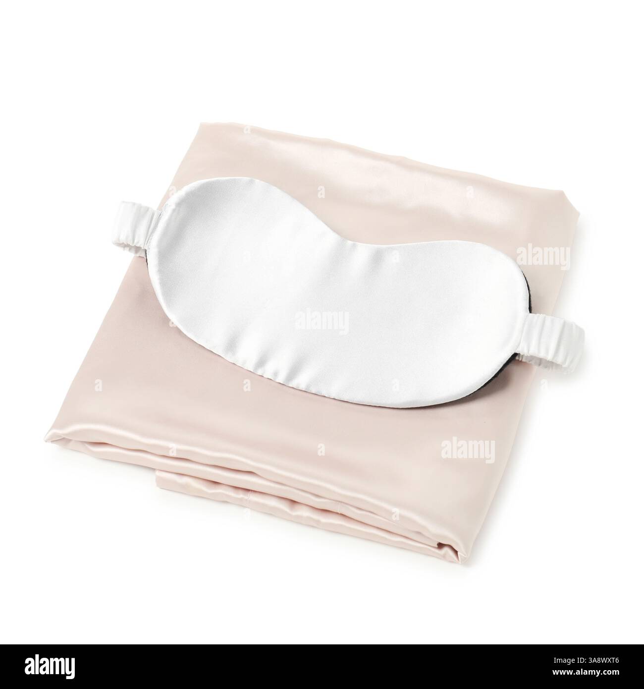 Silky bed linens and sleeping mask on white background Stock Photo - Alamy