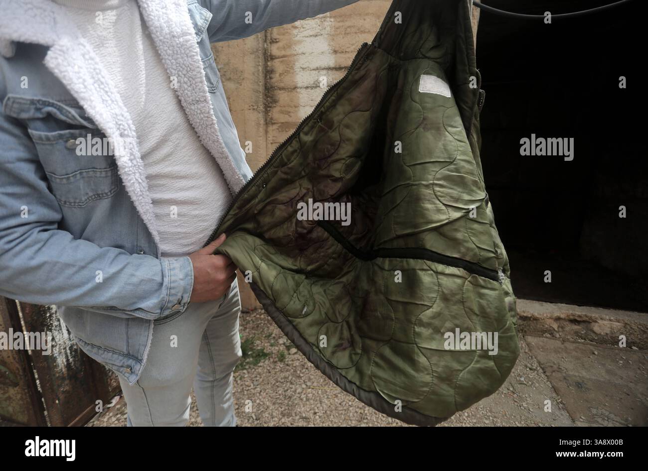 Relatives of Palestinian martyr Ahmed Bani Odeh inspect the site of the ...