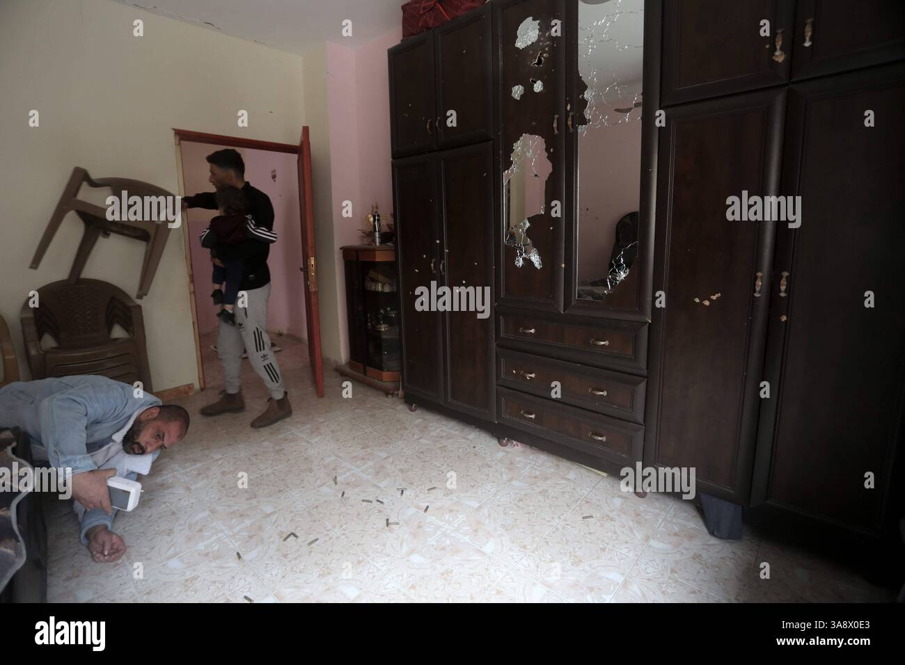 Relatives of Palestinian martyr Ahmed Bani Odeh inspect the site of the ...
