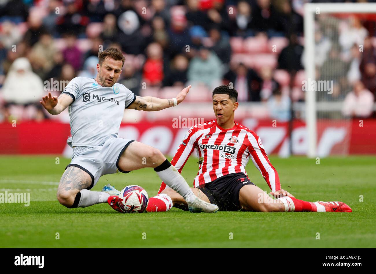 Millwall's Joe Bryan is fouled by Sunderland's Jobe Bellingham (right ...