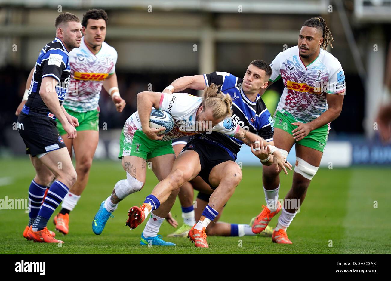 Harlequins' Tyrone Green is tackled by Bath Rugby's Cameron Redpath ...