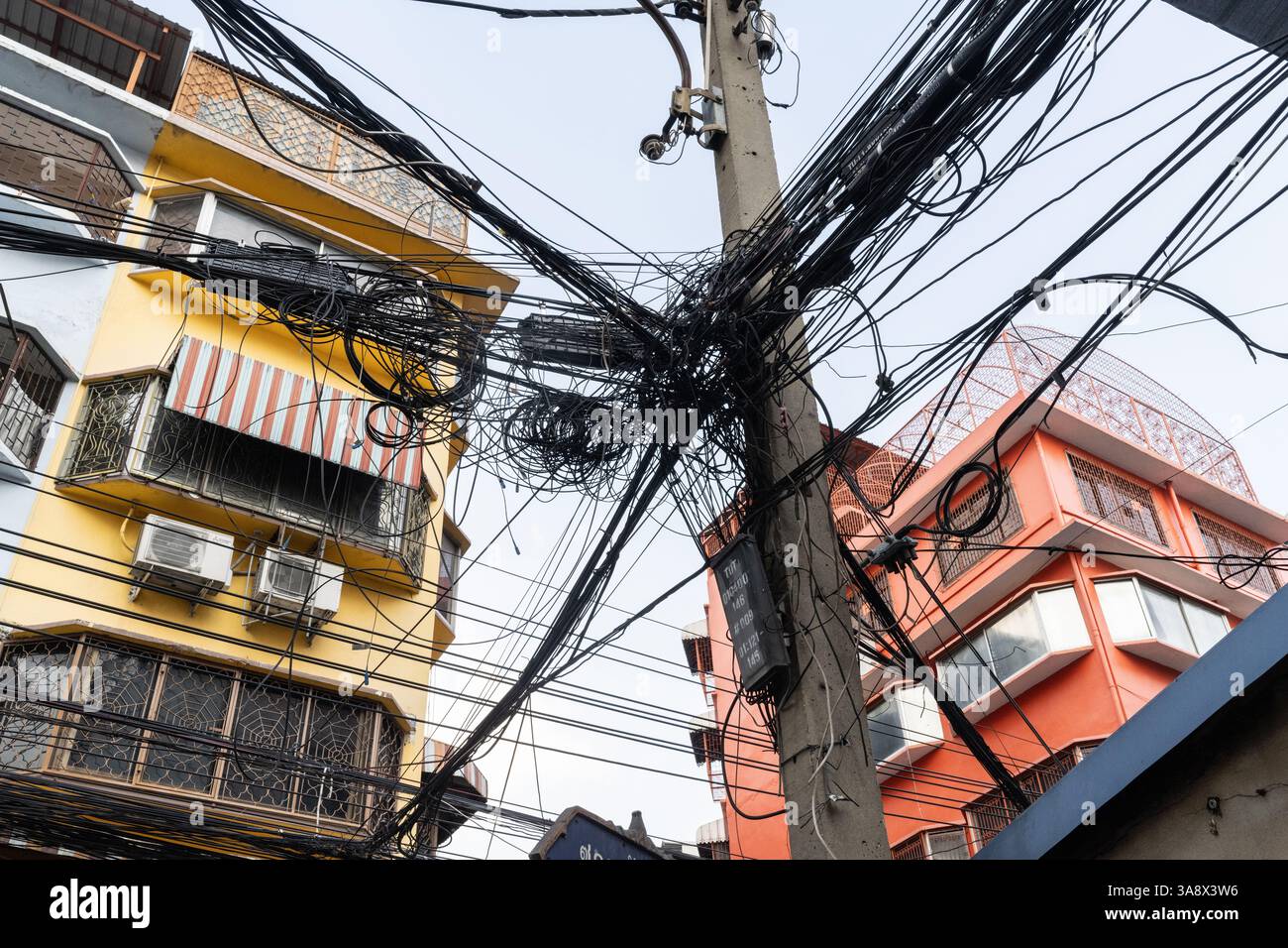 Bangkok, Thailand. 18th Mar, 2025. A tangled mess of cables and wires ...