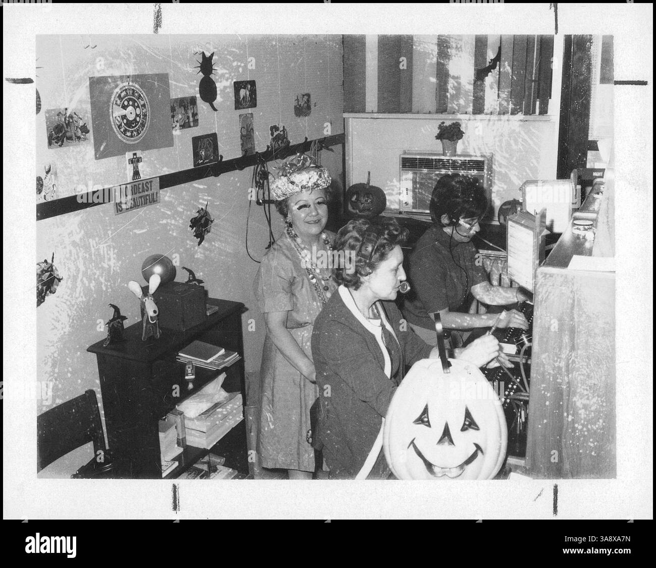 The photo captures a Halloween-themed switchboard office with Gladys ...