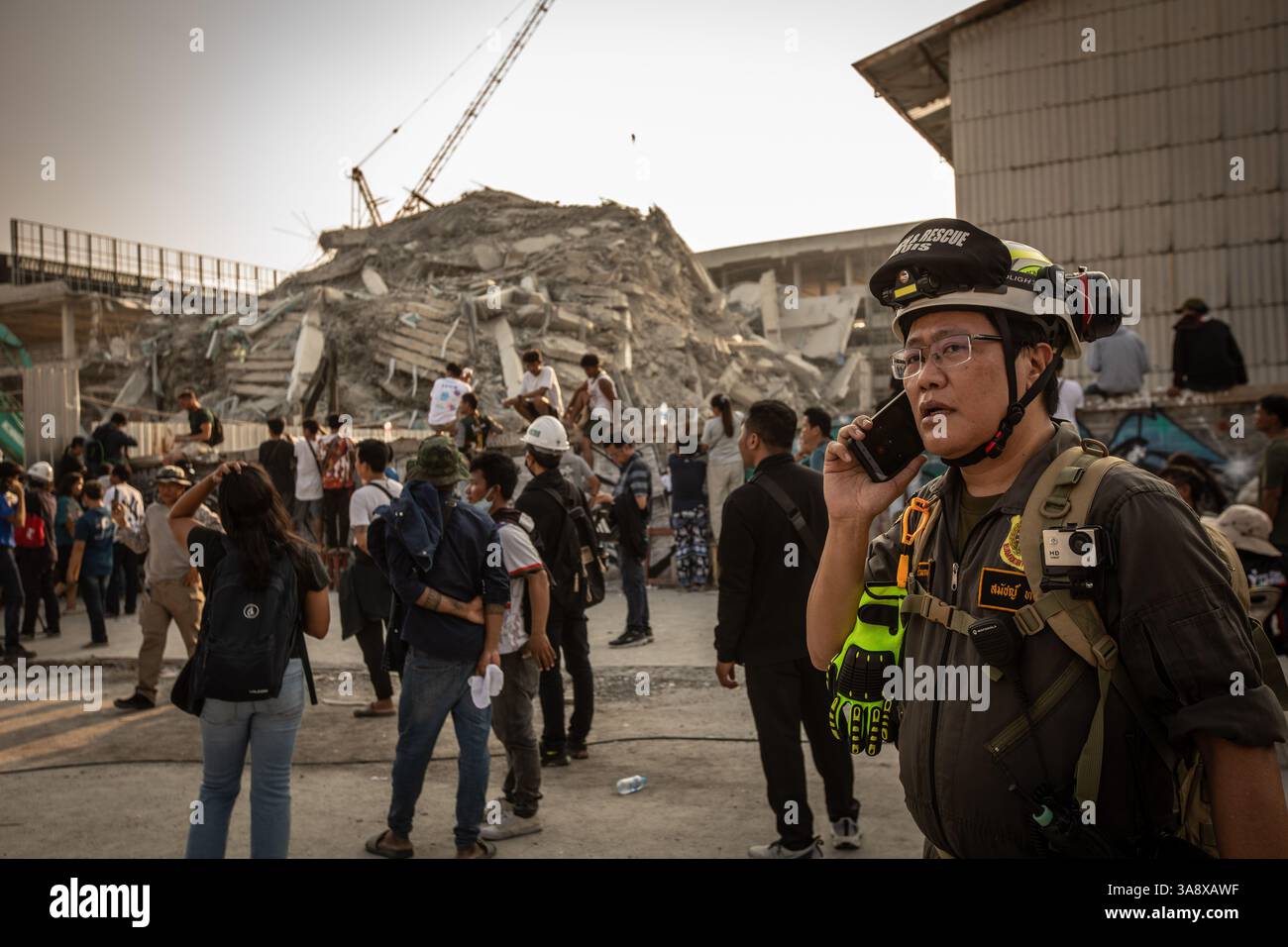 Rescue teams work tirelessly amidst the rubble of a collapsed ...