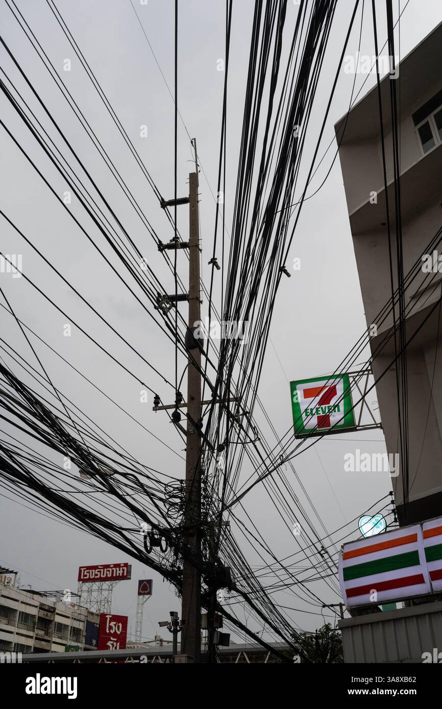March 7, 2025, Bangkok, Thailand: A tangled mess of cables and wires ...