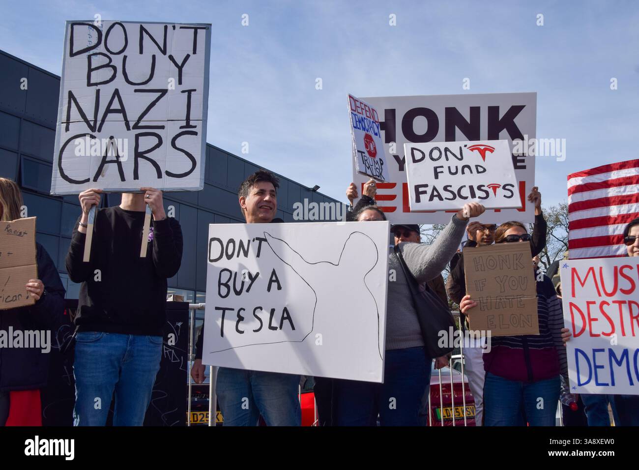 London, UK. 29th March 2025. Protesters gather outside the Tesla Centre ...