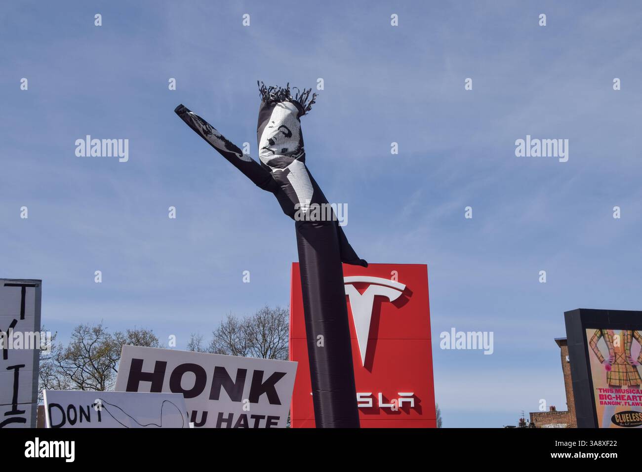 London, UK. 29th March 2025. Protesters put up an Inflatable Musk Tube ...