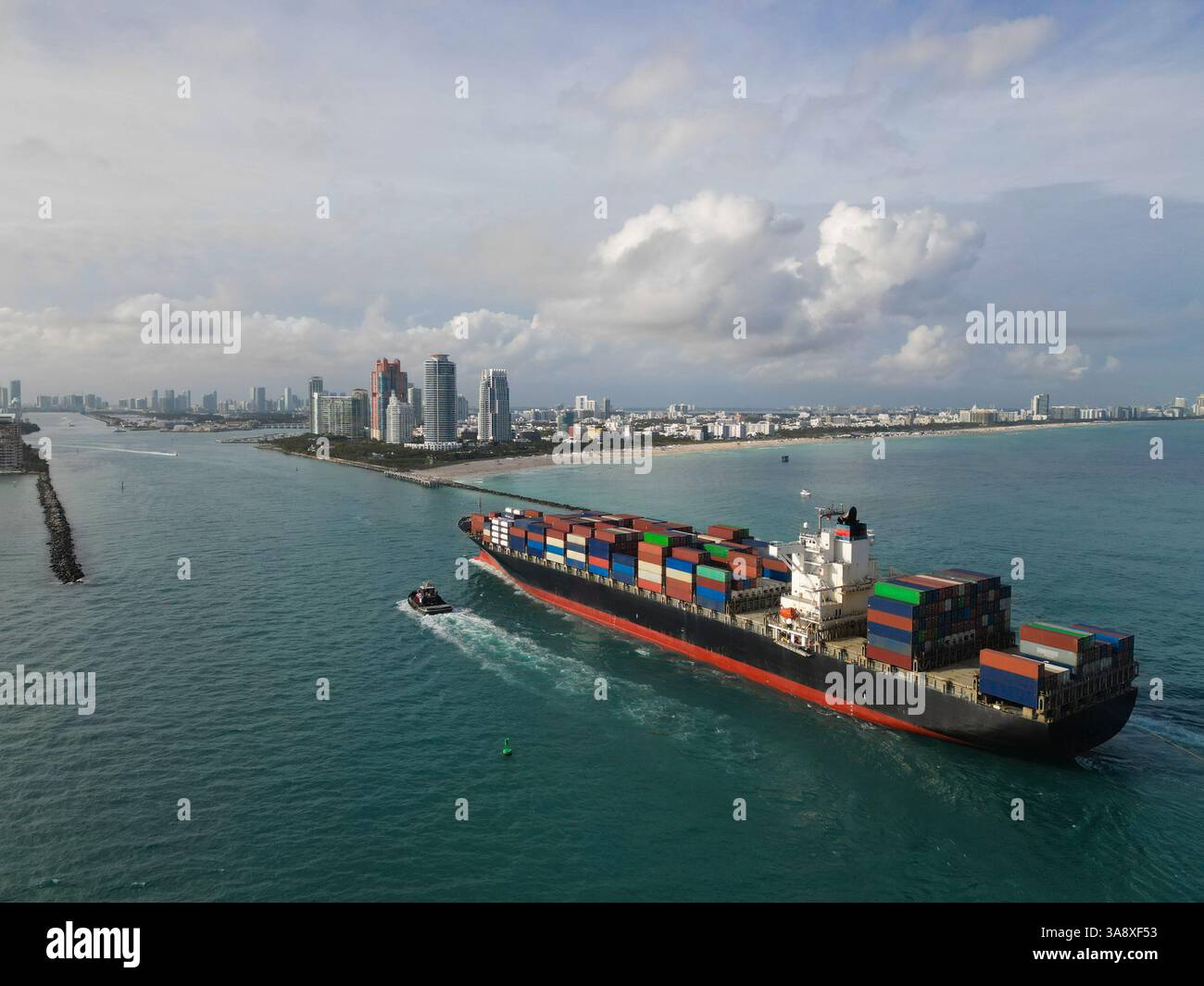 Freight container on cargo vessel. Cargo ship vessel leaving port ...