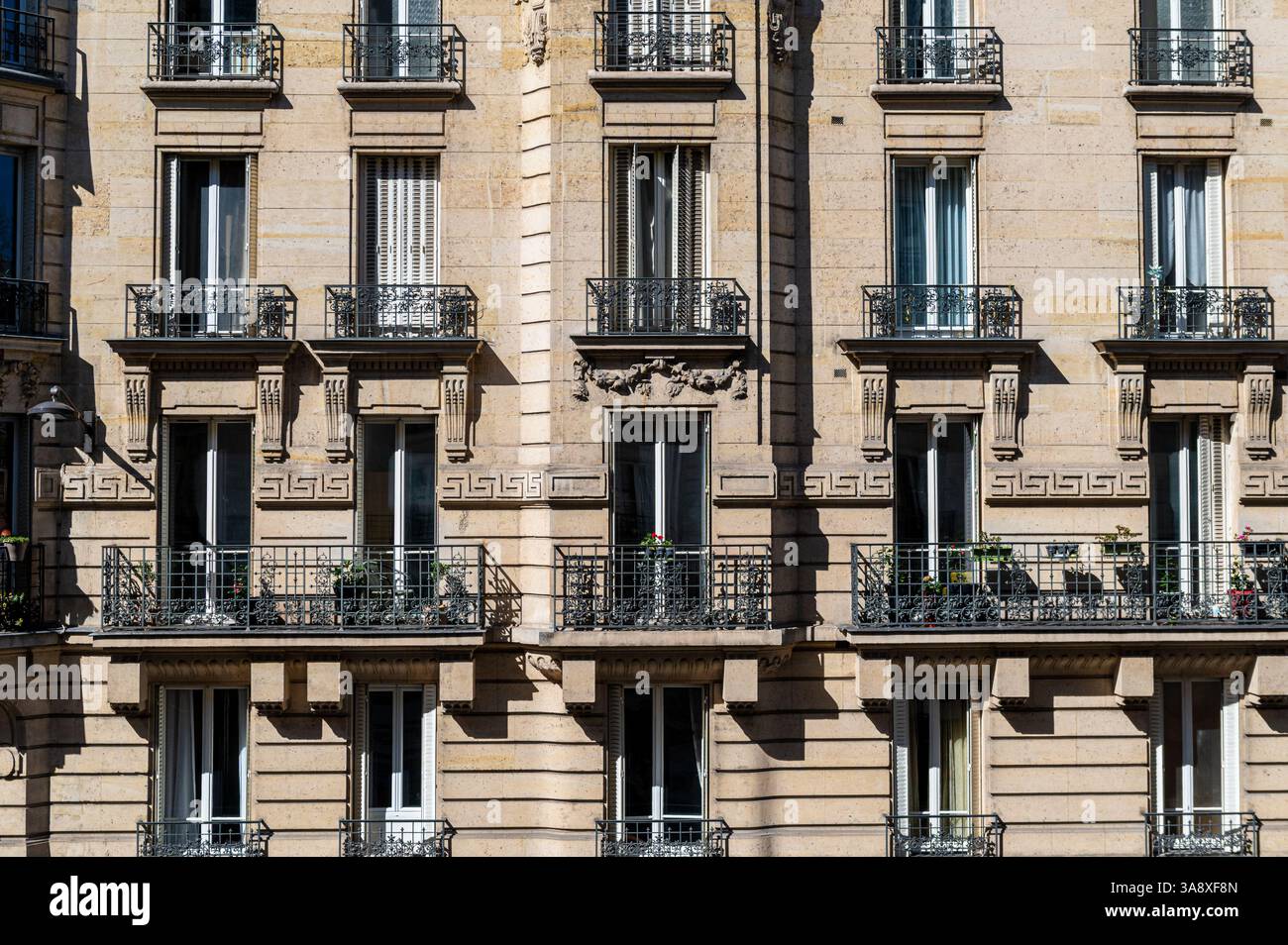 Facade of a typical stone old "Haussmann" style building in Paris ...