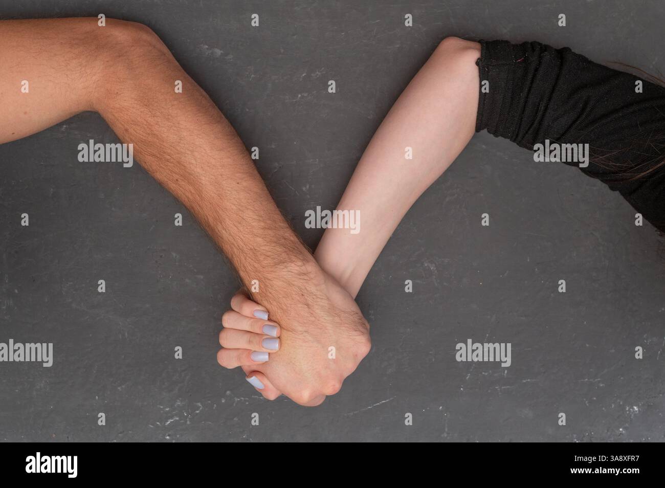 An arm wrestling challenge between a man and a woman. Female power ...