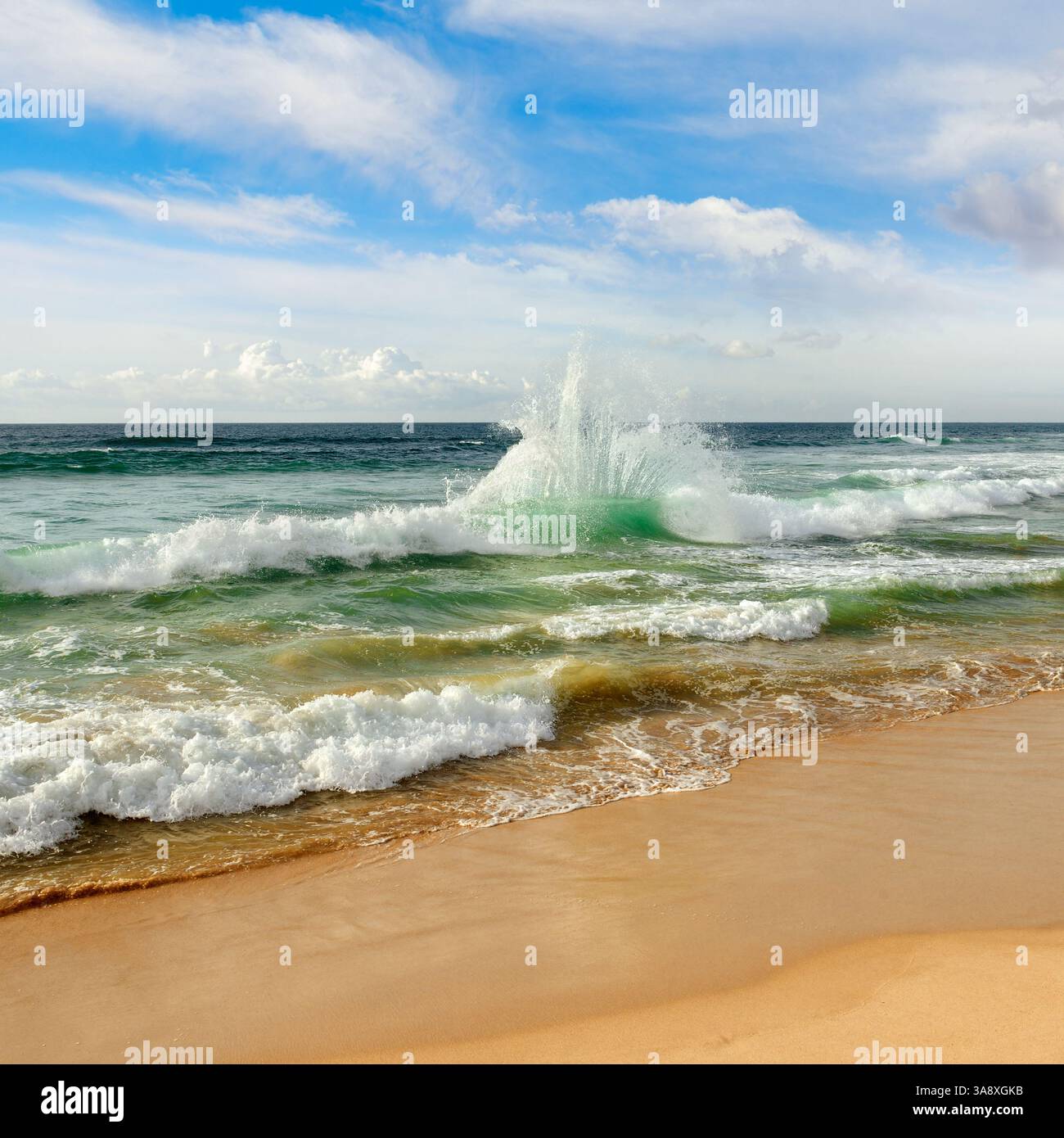 Beautiful surf on the picturesque sandy shore of the ocean Stock Photo ...