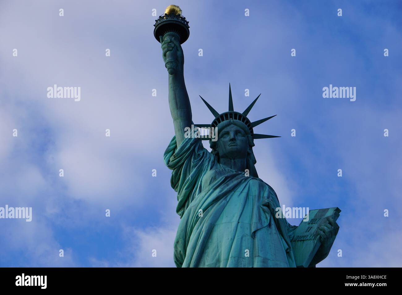 Frontal close up portrait of the landmark Statue of Liberty of New York ...