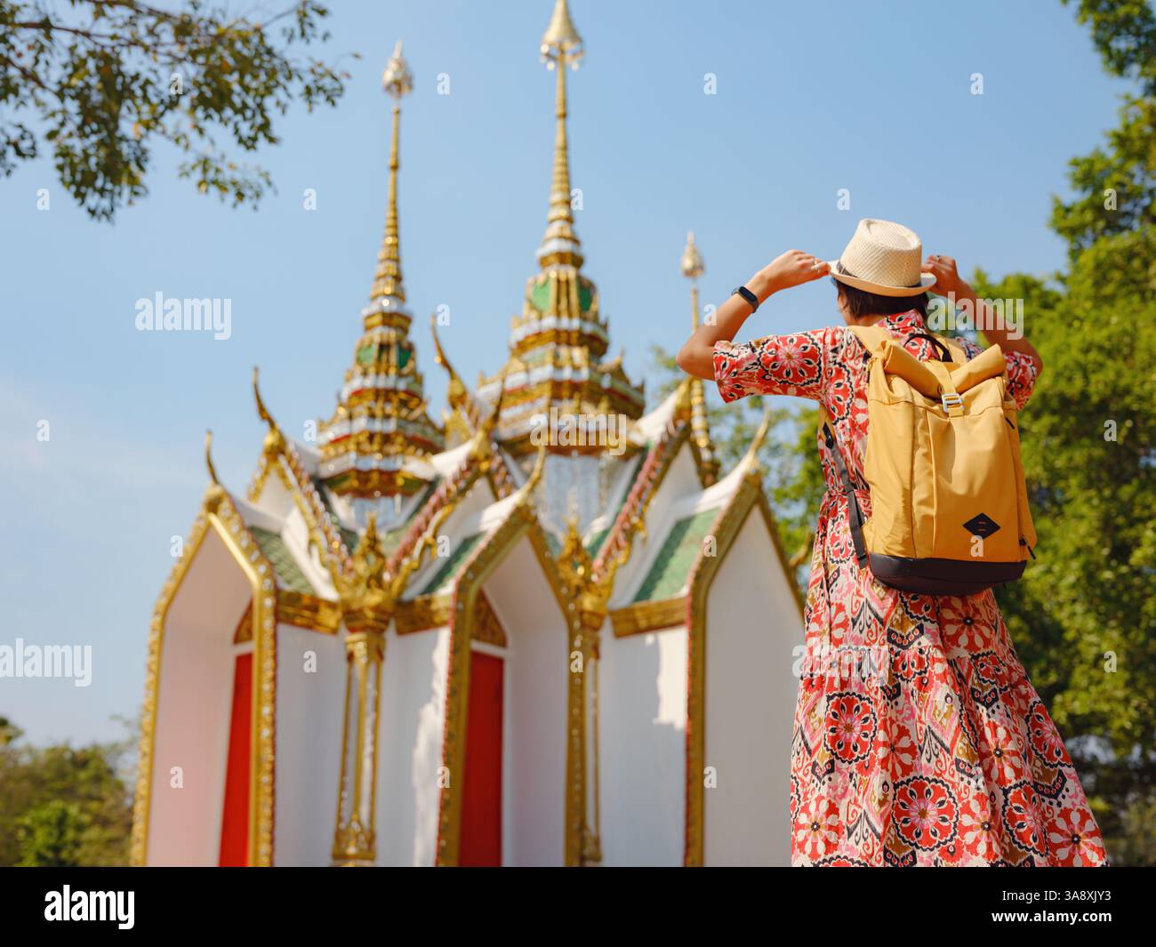 Travel to Thailand. Young female tourist explores modern Buddhist ...