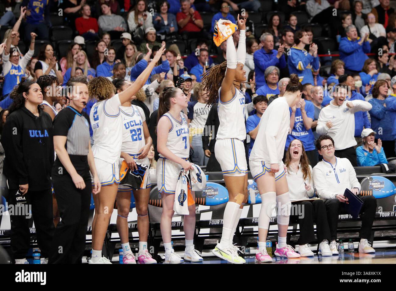 The UCLA bench celebrates during the second half against Mississippi in ...