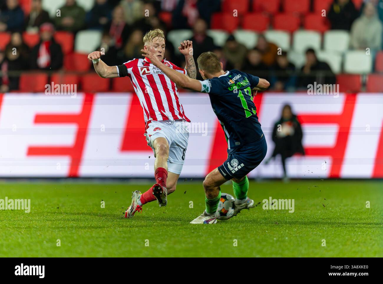 Aalborg, Denmark. 28th Mar, 2025. Melker Widell (8) of AaB and Jeppe ...