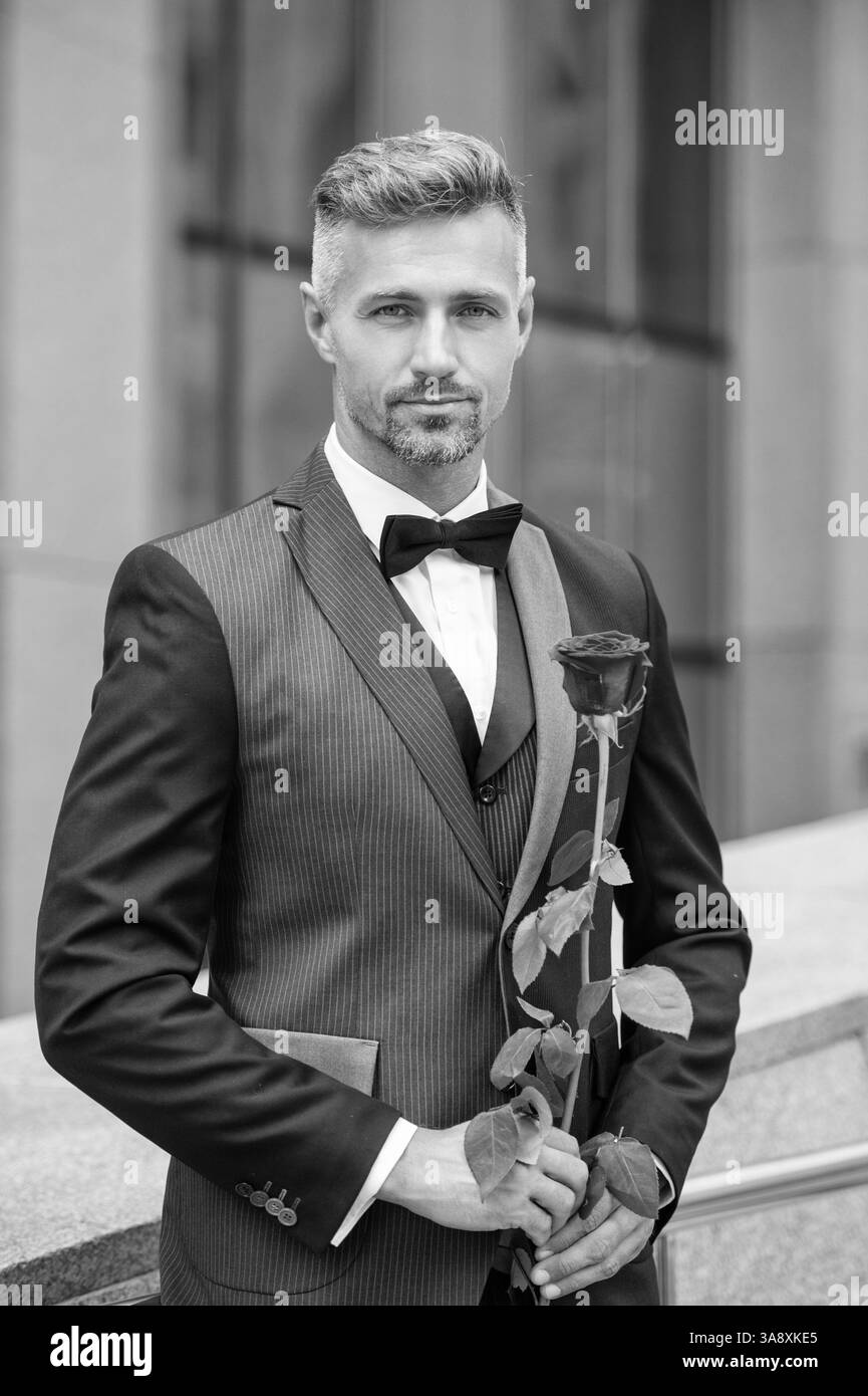 engagement concept. tuxedo man celebrating engagement. man with rose ...