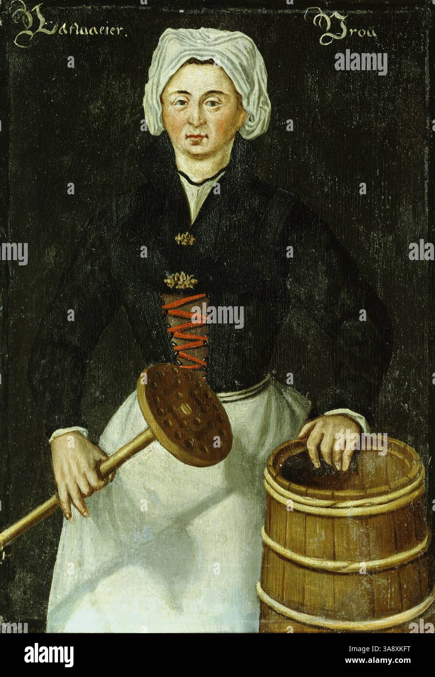 Woman from Wadwaay. The left hand on a churn (hand churn), in the right ...