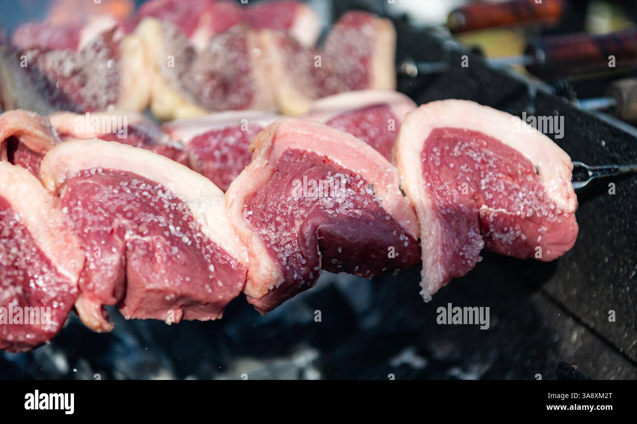 Grilled roast beef. Grilled picanha. Brazilian BBQ cuisine. Family ...