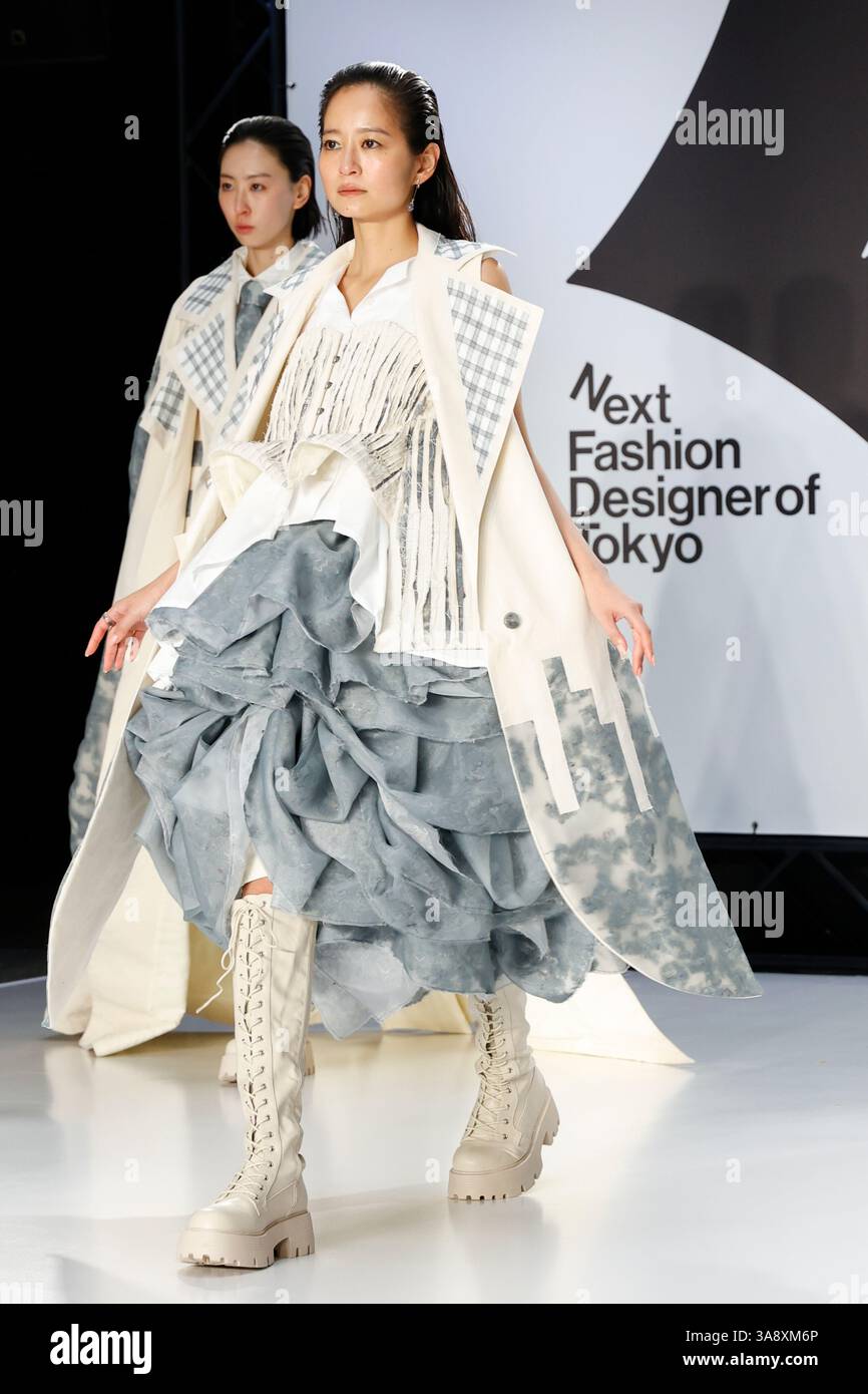 Tokyo, Japan. 29th Mar, 2025. Models walk down a runway during the ...