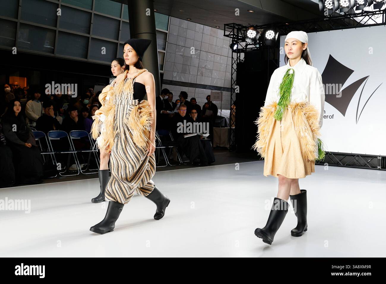 Tokyo, Japan. 29th Mar, 2025. Models walk down a runway during the ...