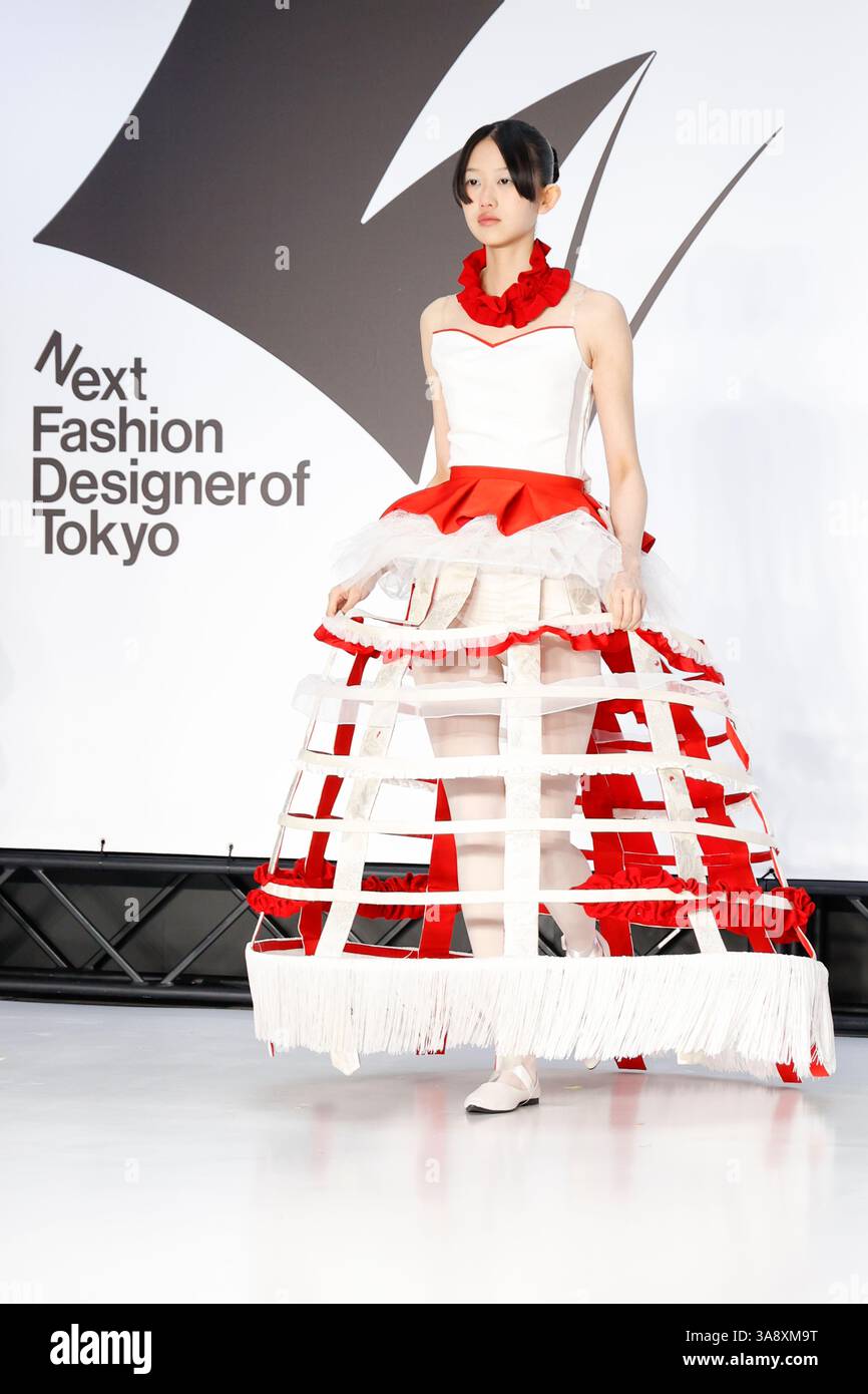 Tokyo, Japan. 29th Mar, 2025. A model walks down a runway during the ...