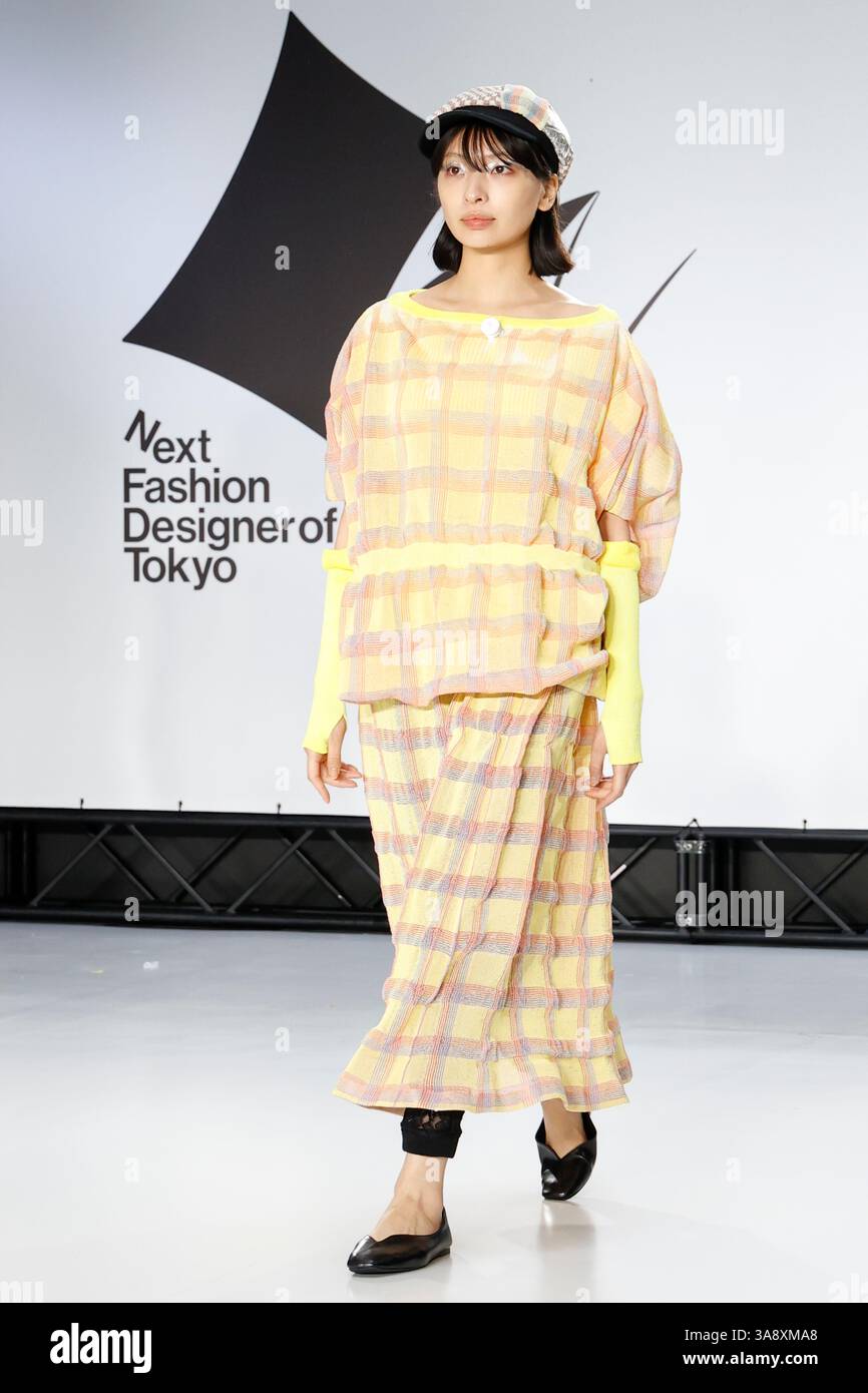 Tokyo, Japan. 29th Mar, 2025. A model walks down a runway during the ...
