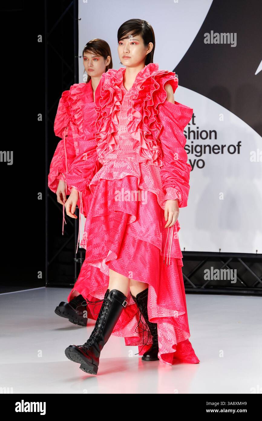 Tokyo, Japan. 29th Mar, 2025. Models walk down a runway during the ...