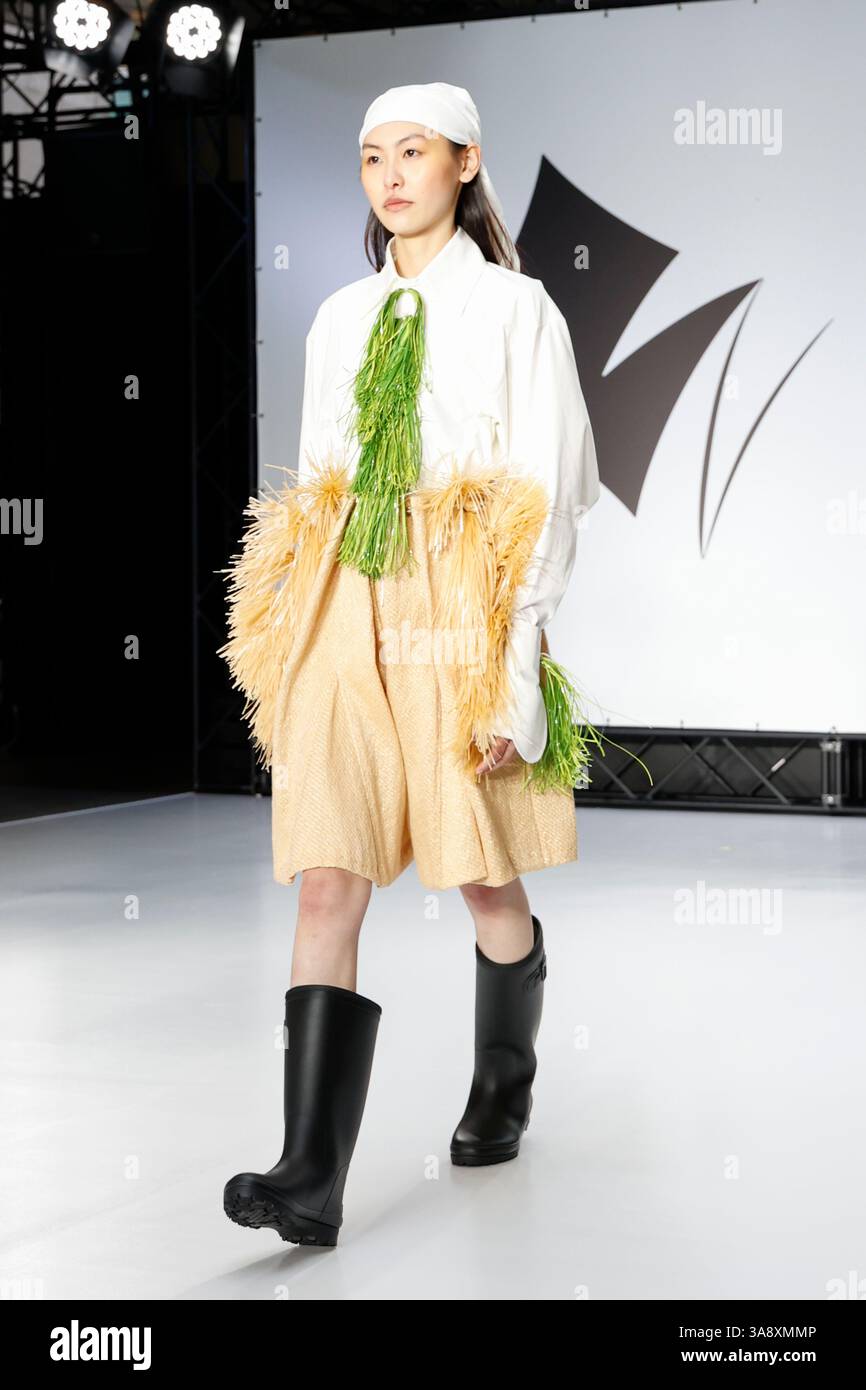 March 29, 2025, Tokyo, Japan: A model walks down a runway during the ...