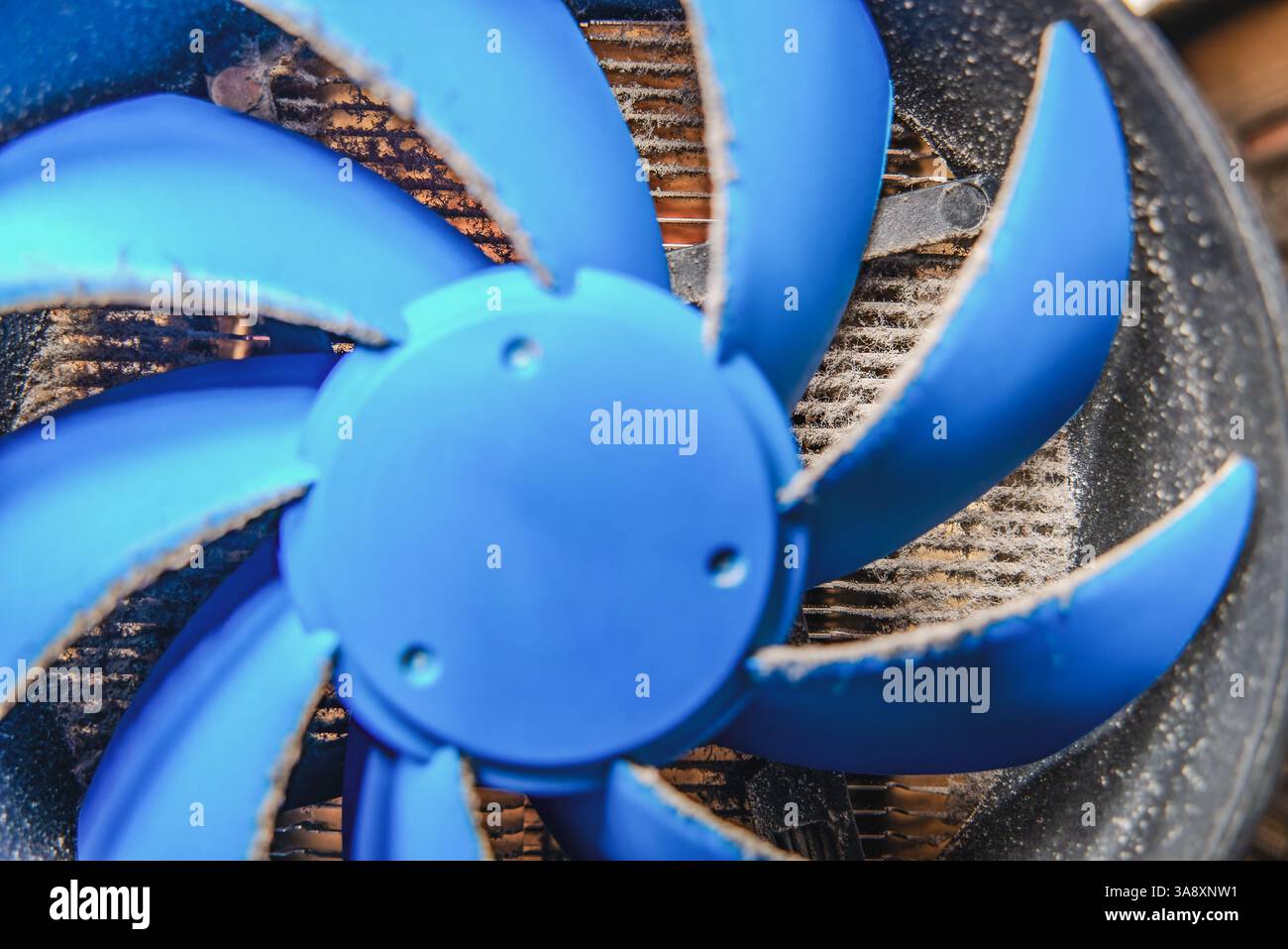 Extreme close-up of a dusty CPU cooler and heatsink clogged with thick ...