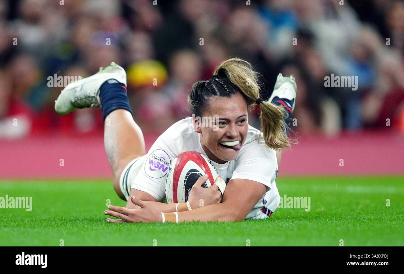 England’s Maddie Feaunati scores their first try of the game during the ...