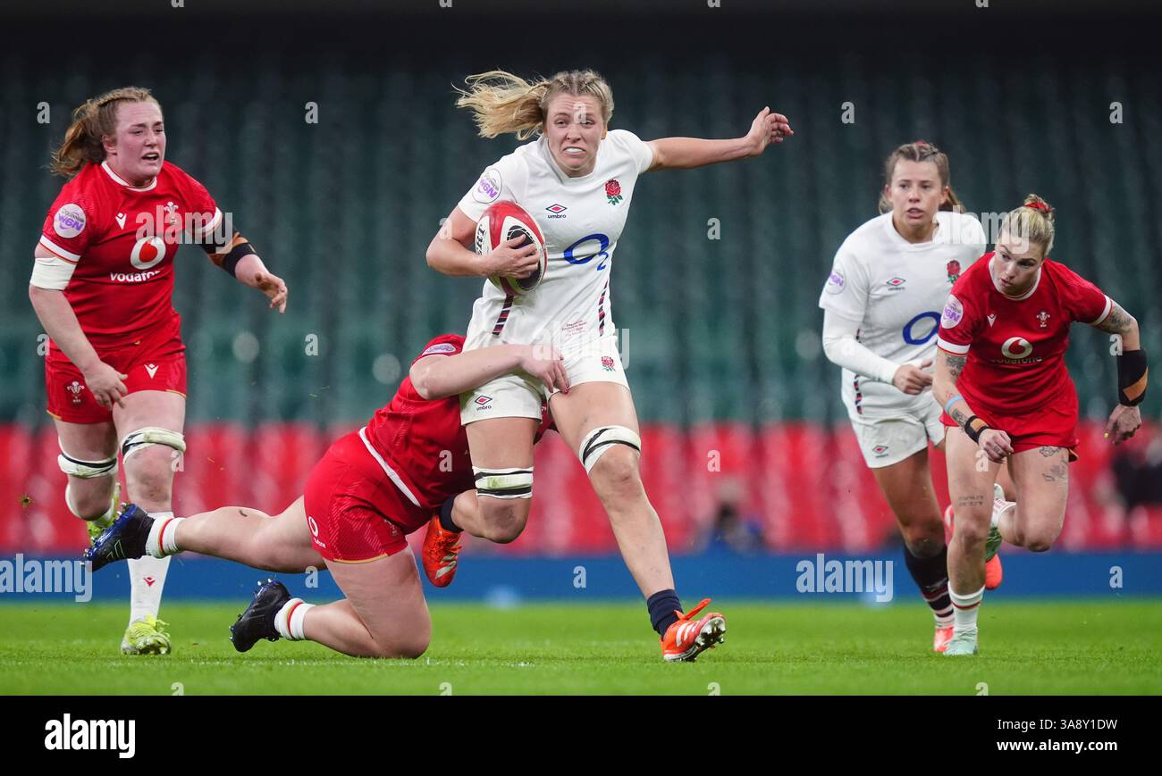 England’s Zoe Aldcroft (right) is tackled by Wales’ Gwenlilian Pyrs ...