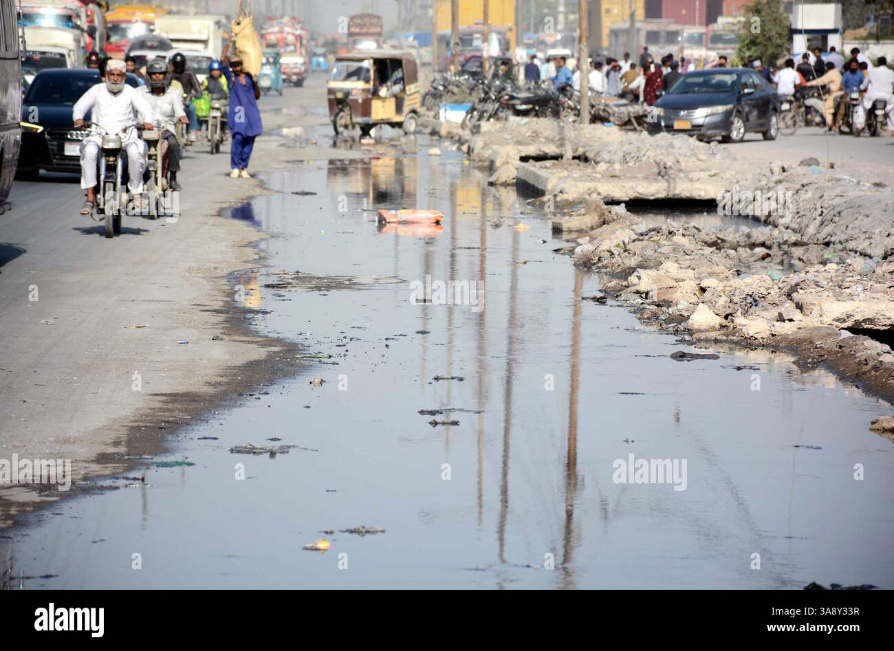 KARACHI, PAKISTAN, MAR 29: Inundated road by overflowing sewerage water ...