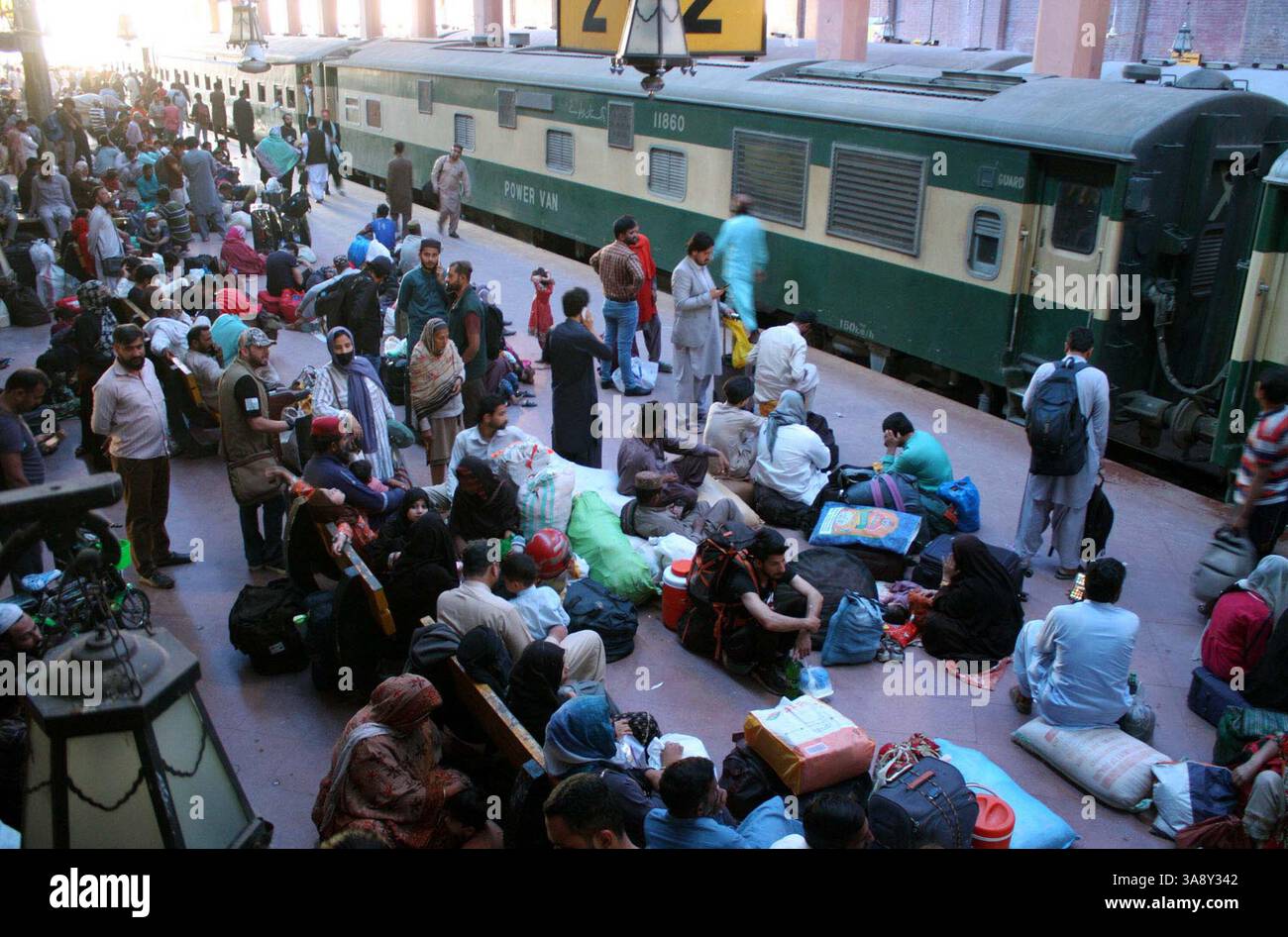 A large number of people gather for boarding on special Eid train as they are going to their ...
