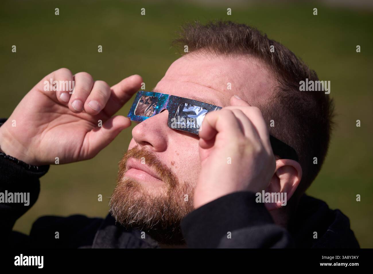 Visitors gather to watch the partial solar eclipse at the Copernicus ...