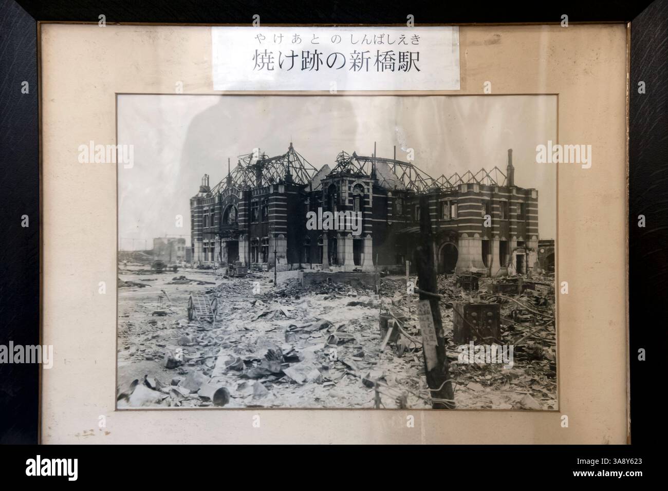 Vintage photo showing the burnt ruins of the Shimbashi train station ...