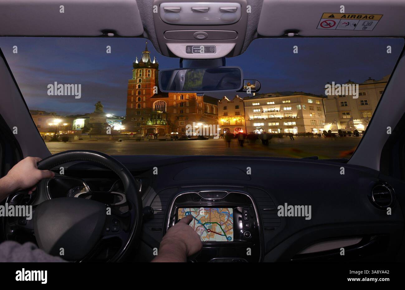 Driving a car while using the touch screen of a GPS navigation system ...