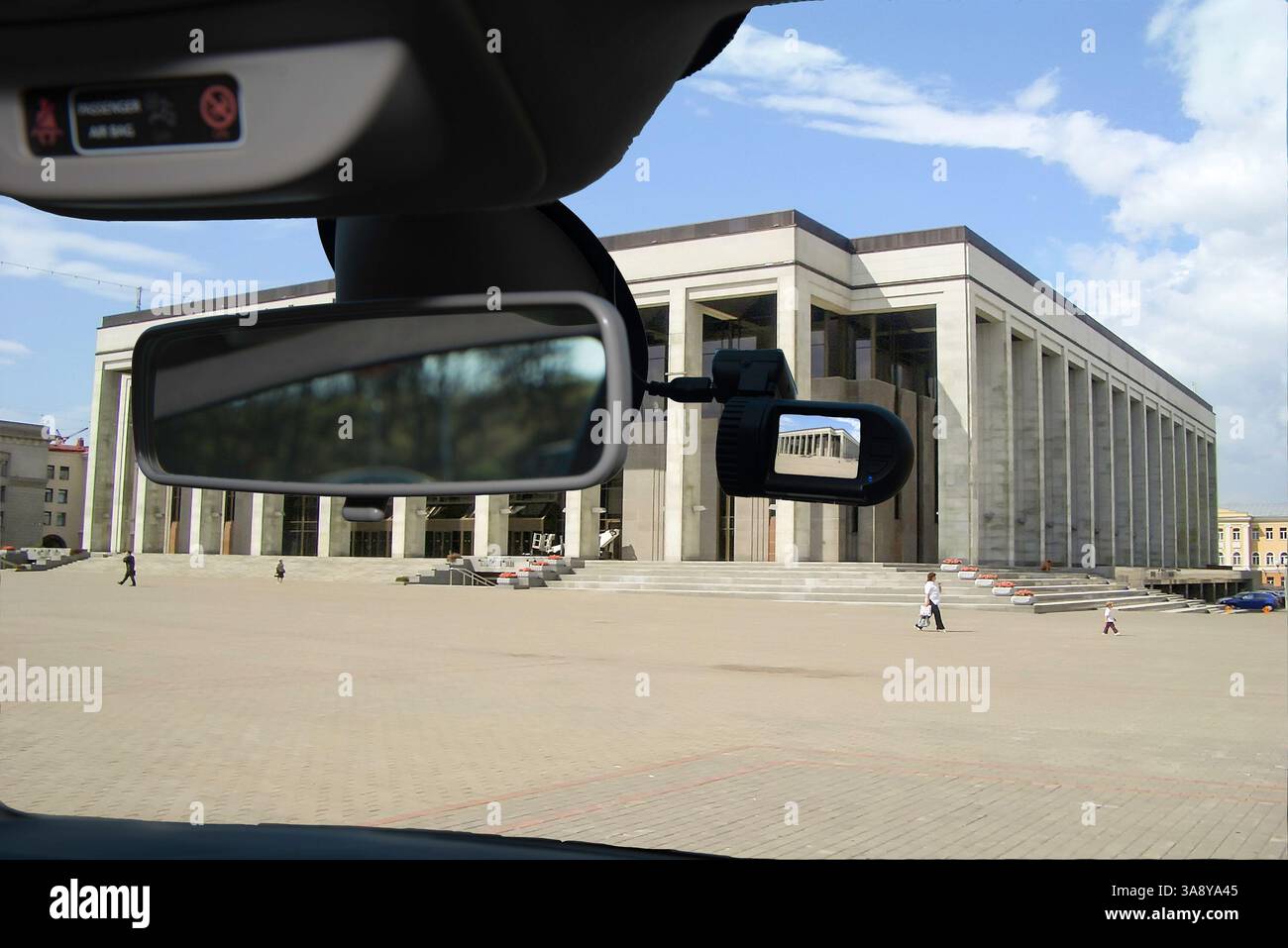 Looking through a dashcam car camera installed on a windshield with ...
