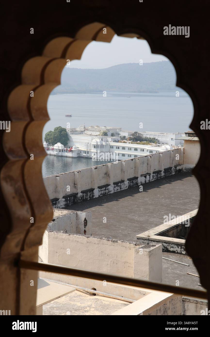 View of Taj Lake Palace from window of City Palace in Udaipur, India ...
