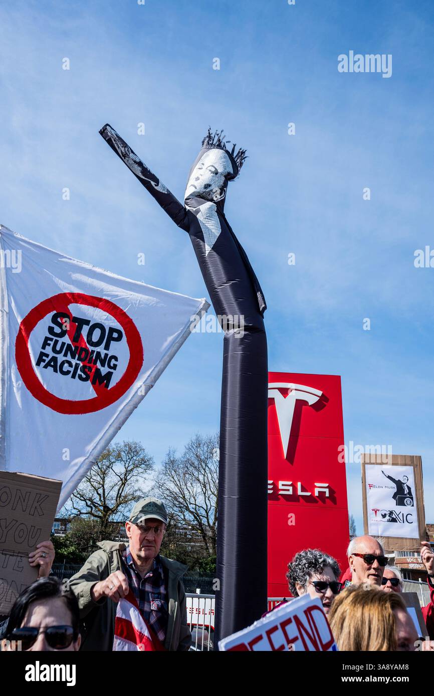 A blow-up inflatable reproduces Elon Musk's infamous Nazi salute during ...