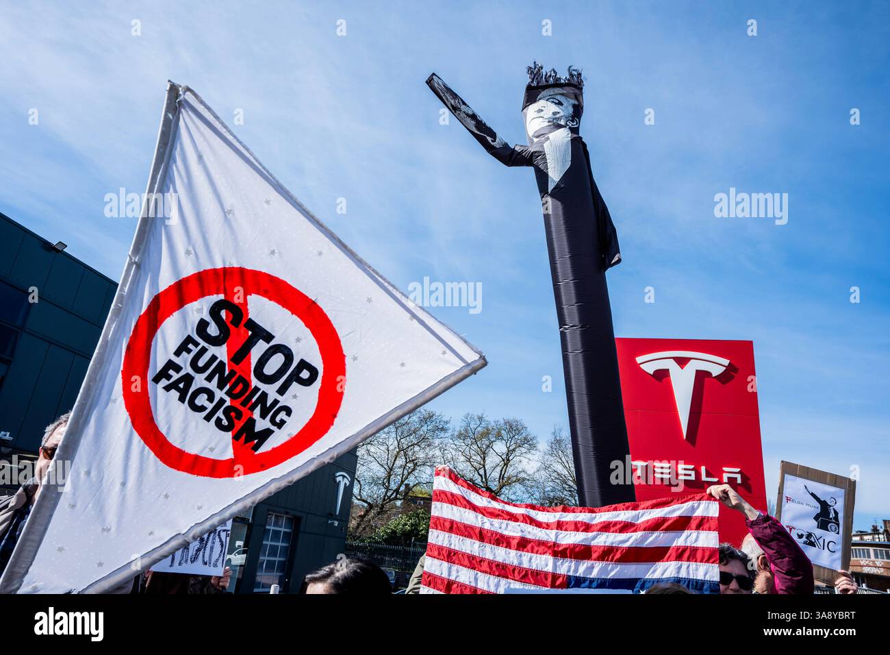 A blow-up inflatable reproduces Elon Musk's infamous Nazi salute during ...