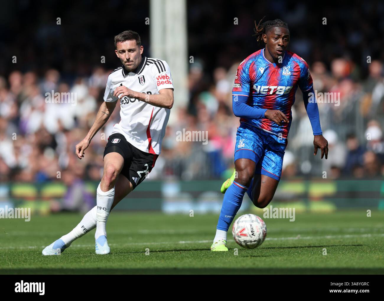 London, UK. 29th Mar, 2025. Timothy Castagne of Fulham with Eberechi ...