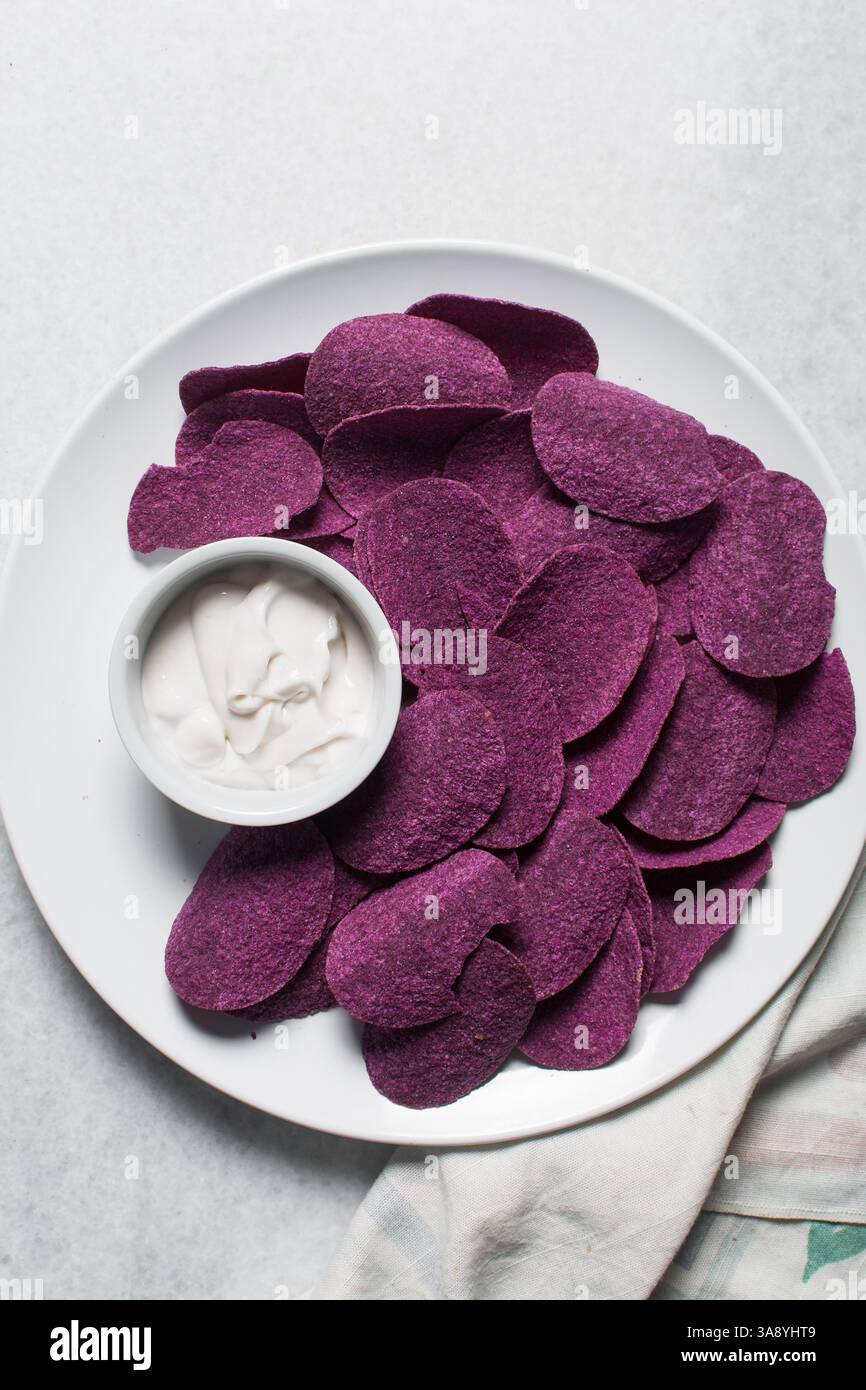 Overhead view of purple sweet potato chips and dip, top view of ube ...
