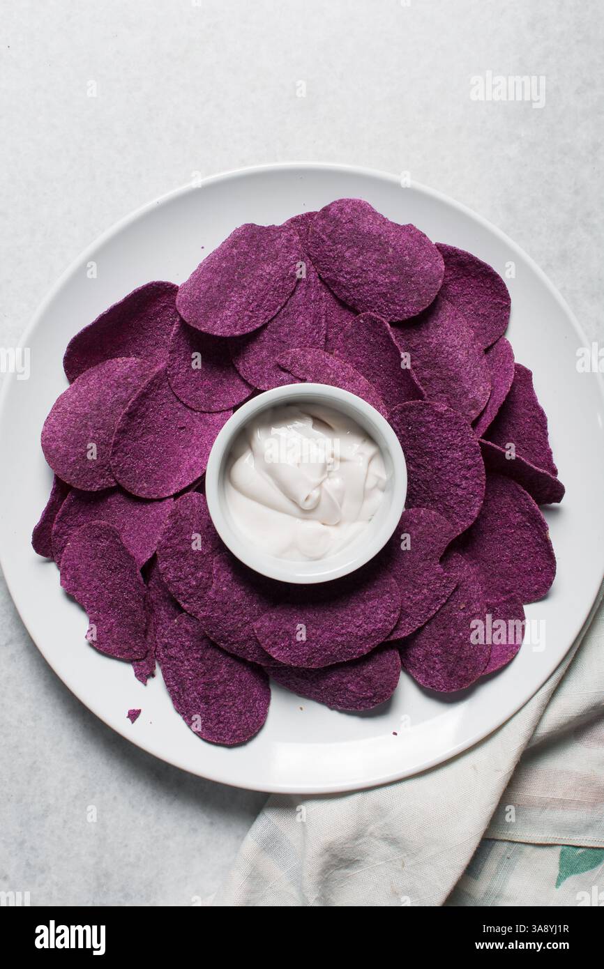 Overhead view of purple sweet potato chips and dip, top view of ube ...