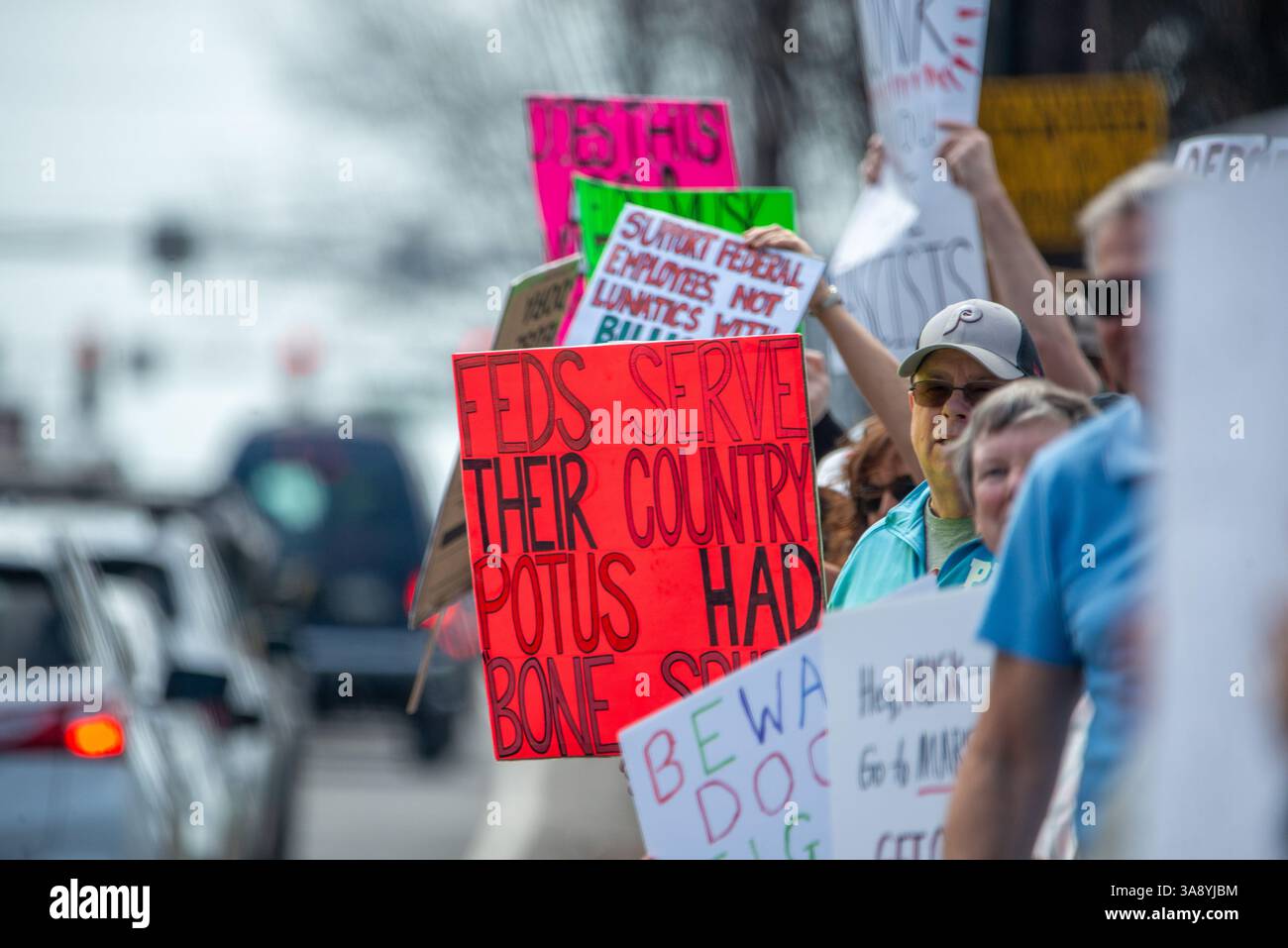 People wave flags during a rally against US President Trump, Elon Musk ...